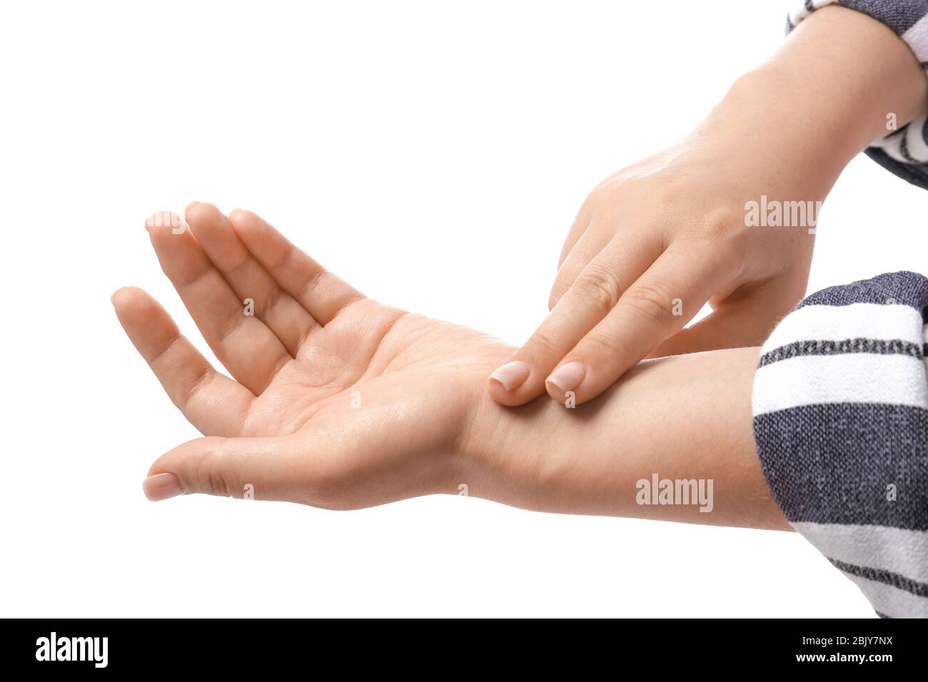 Woman checking her pulse on white background Stock Photo - Alamy