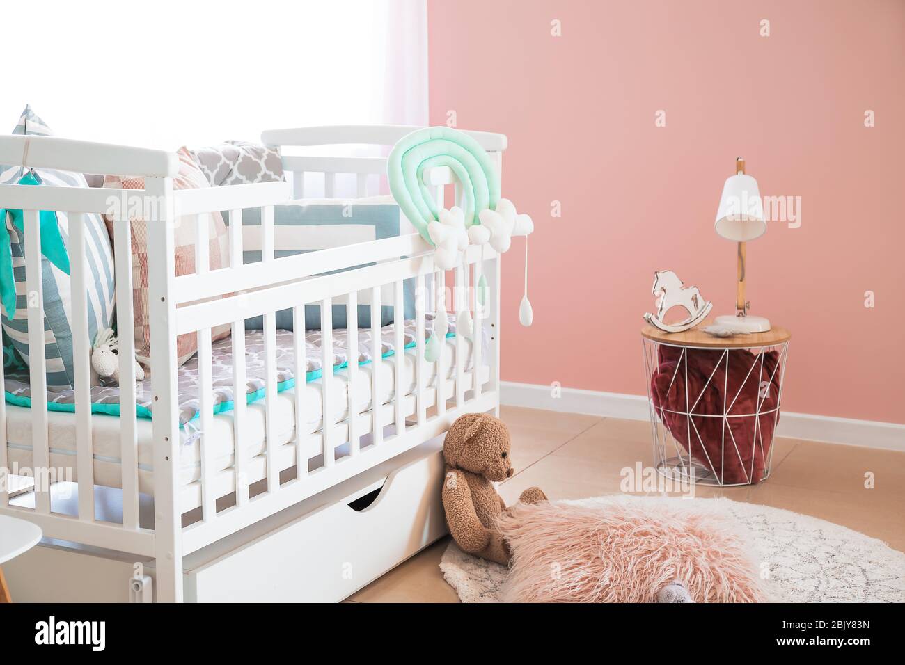 Stylish baby bed in modern interior of children's room Stock Photo - Alamy