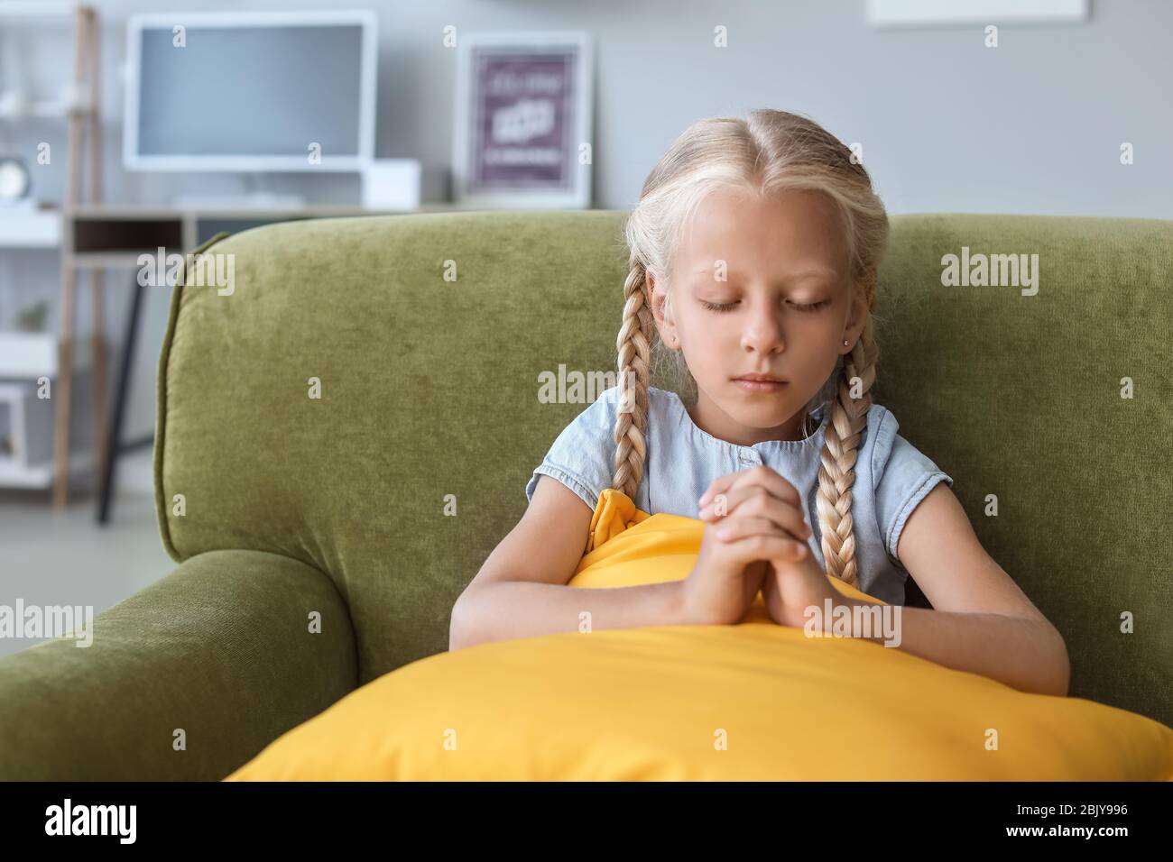 Little girl praying at home Stock Photo - Alamy