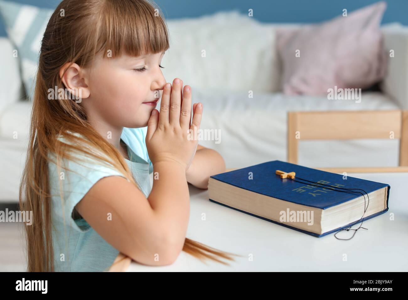 Little girl praying at home Stock Photo - Alamy