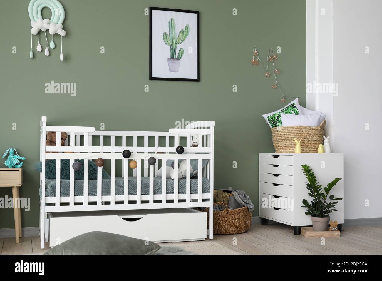 Interior of modern baby room with crib Stock Photo - Alamy