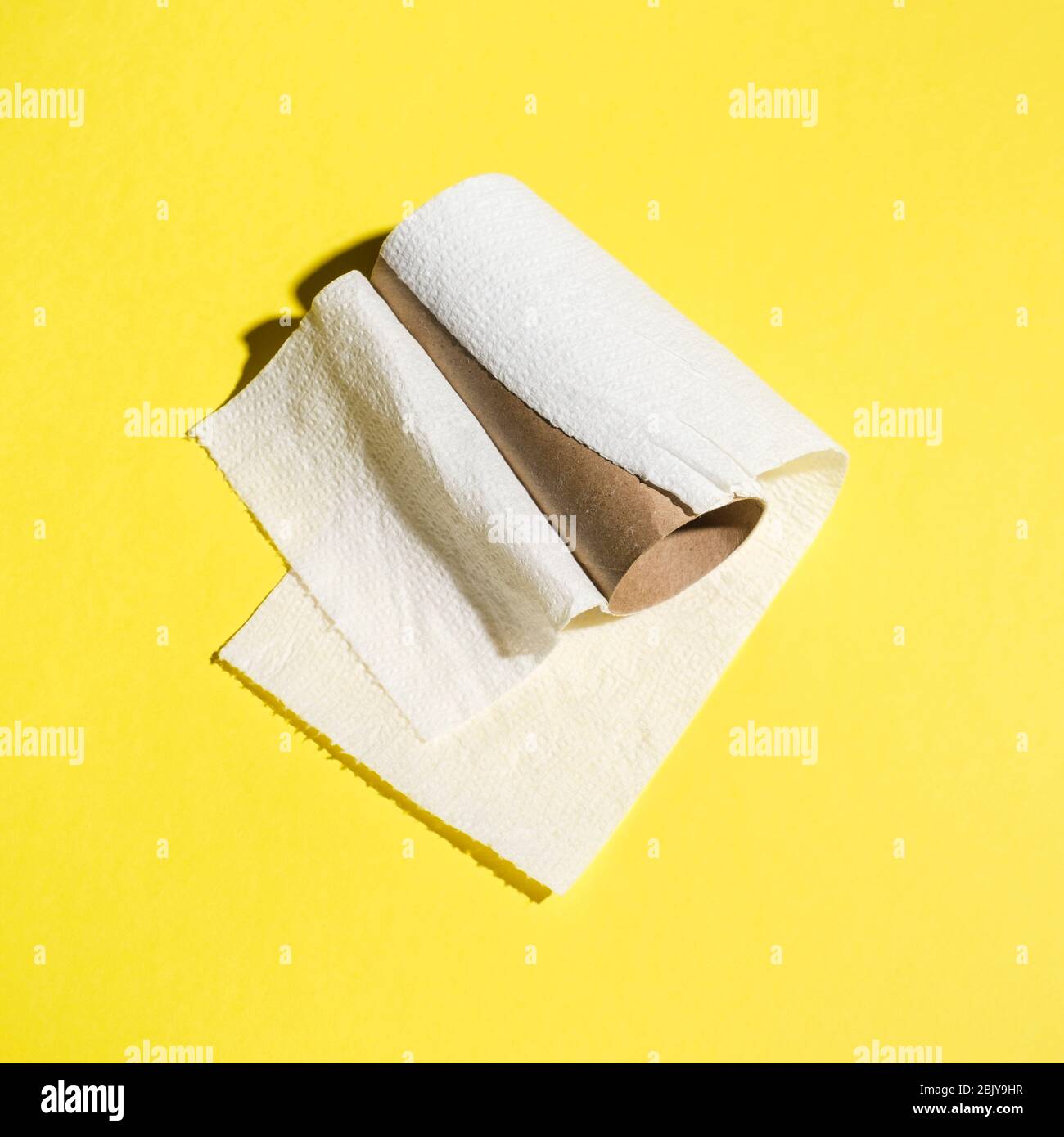 Used up roll of toilet paper on yellow backgroundÂ Stock Photo - Alamy