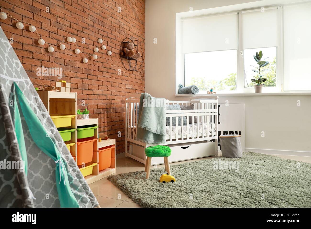 Interior of modern baby room with crib Stock Photo - Alamy