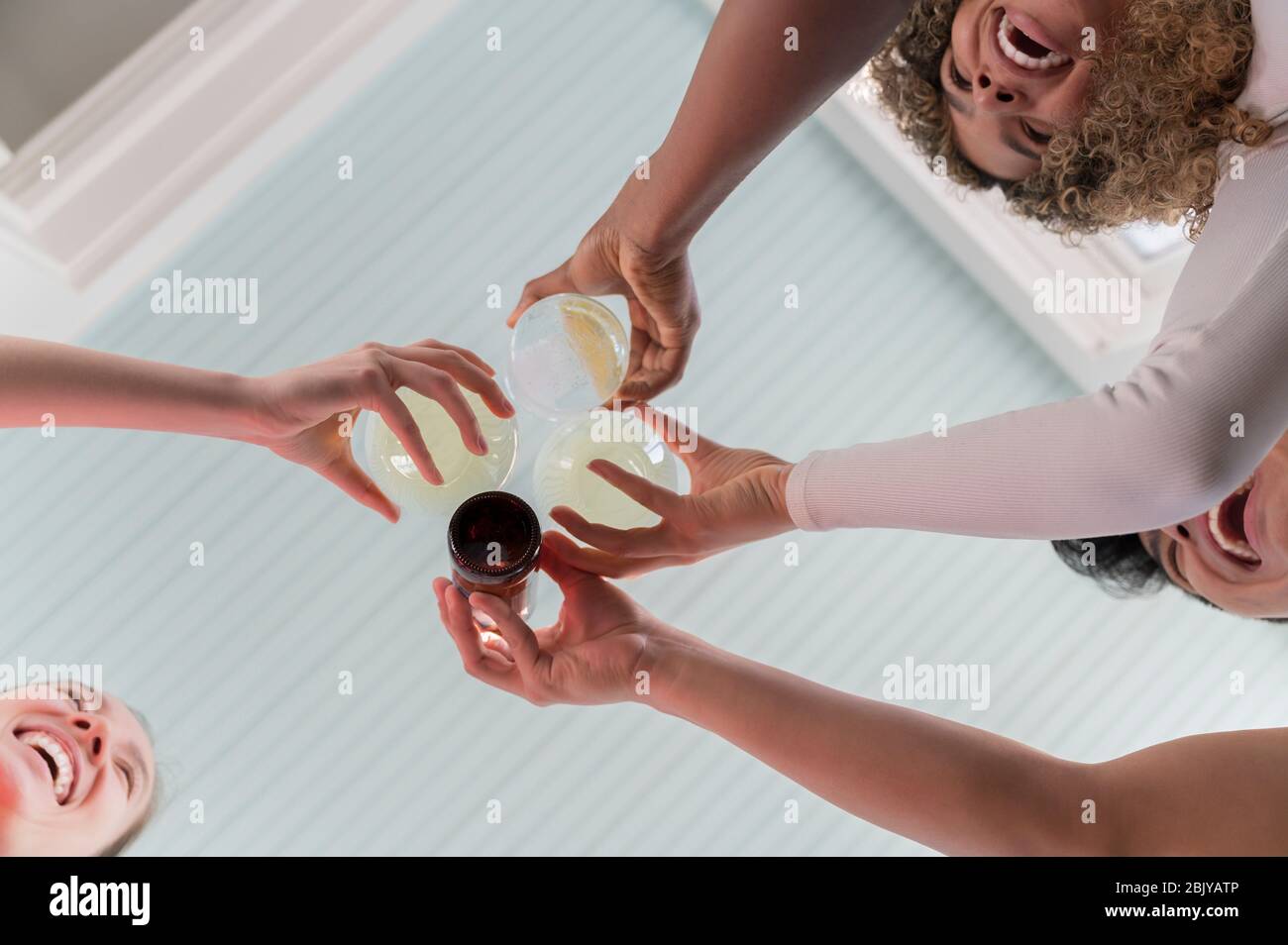 Friends having toast with drinks together Stock Photo - Alamy