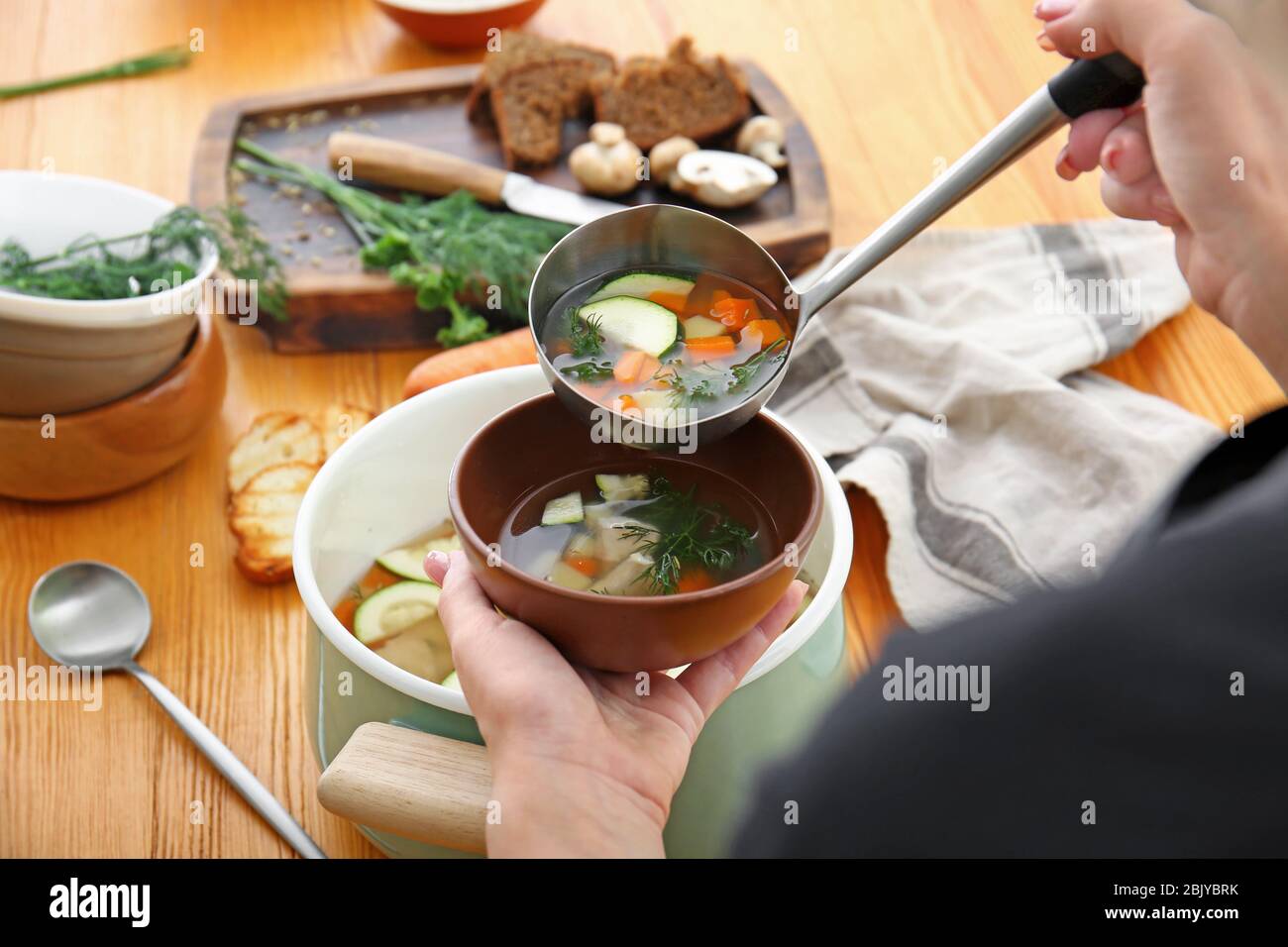 Pouring broth into pot hi-res stock photography and images - Alamy
