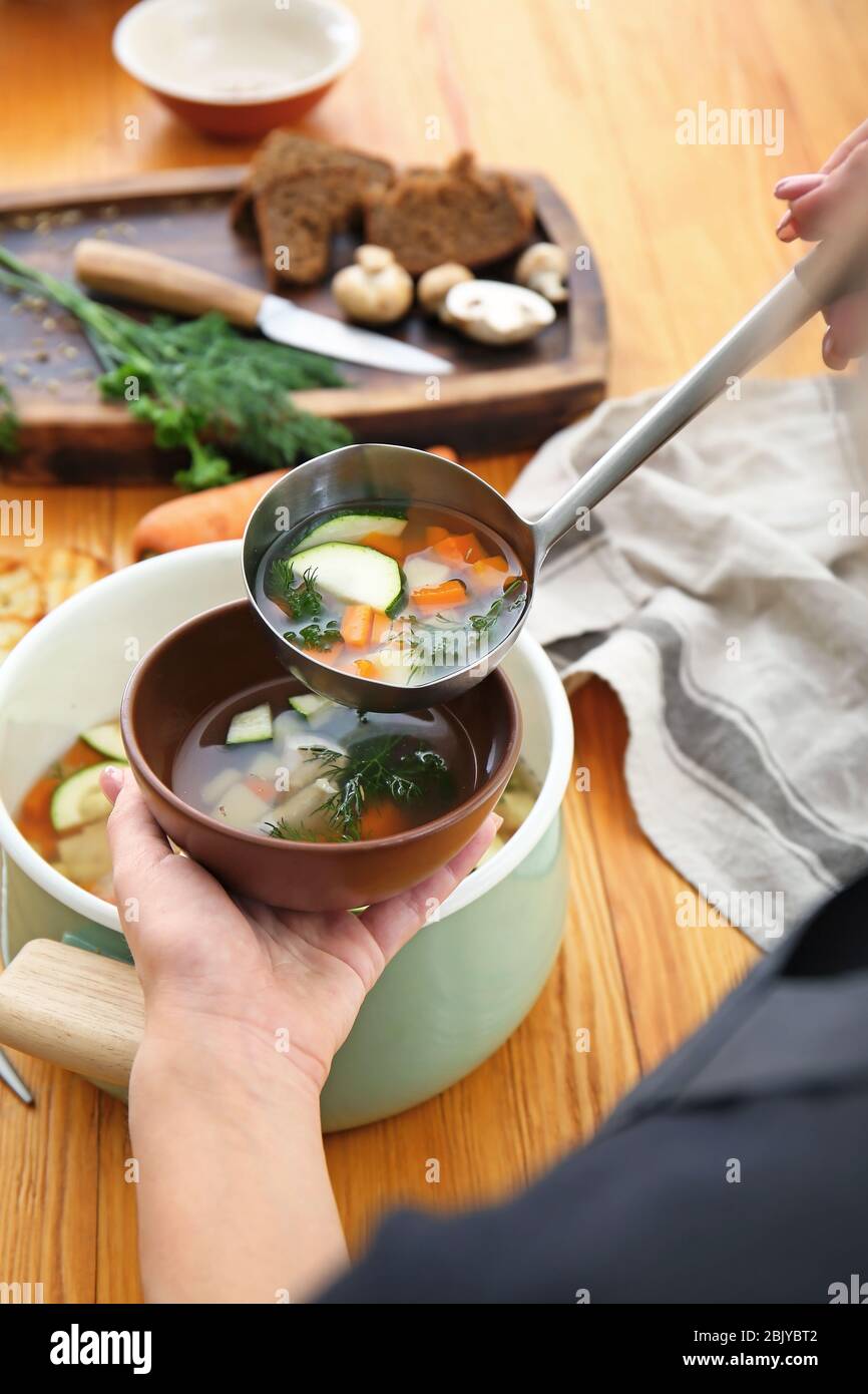 Pouring broth into pot hi-res stock photography and images - Alamy