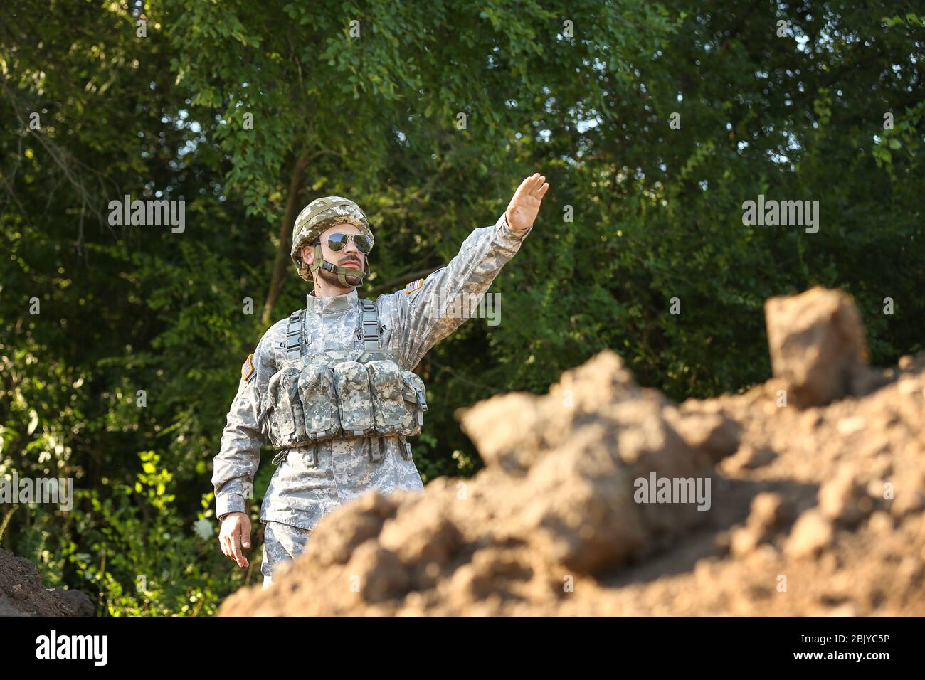 Male soldier in fighting position Stock Photo - Alamy