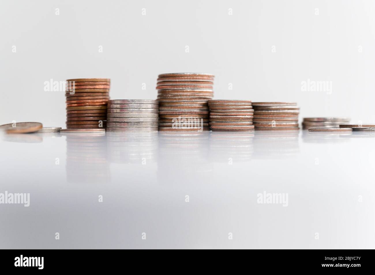 Coins in stacks Stock Photo - Alamy