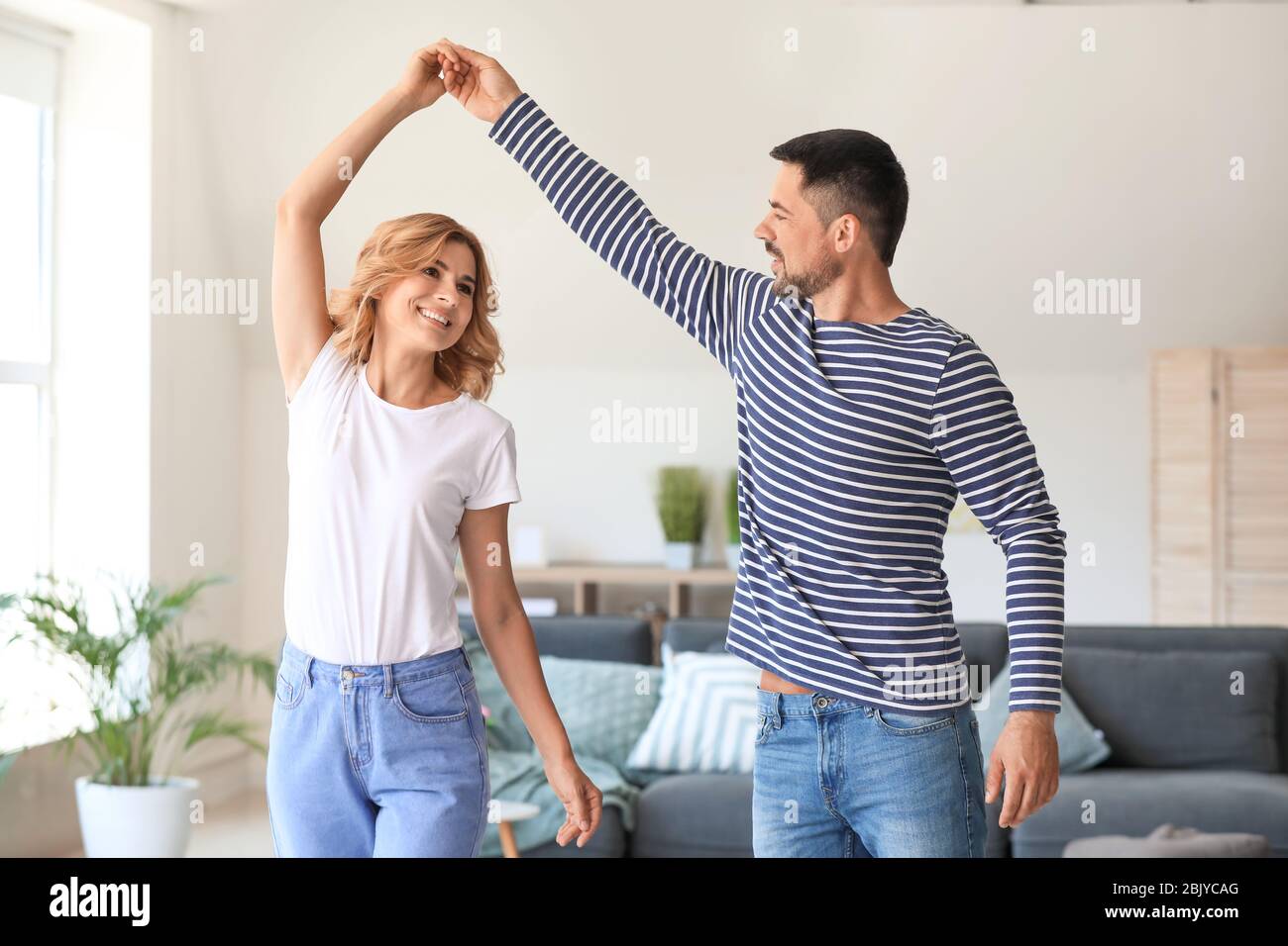 Happy couple home dancing rhythm hi-res stock photography and images ...
