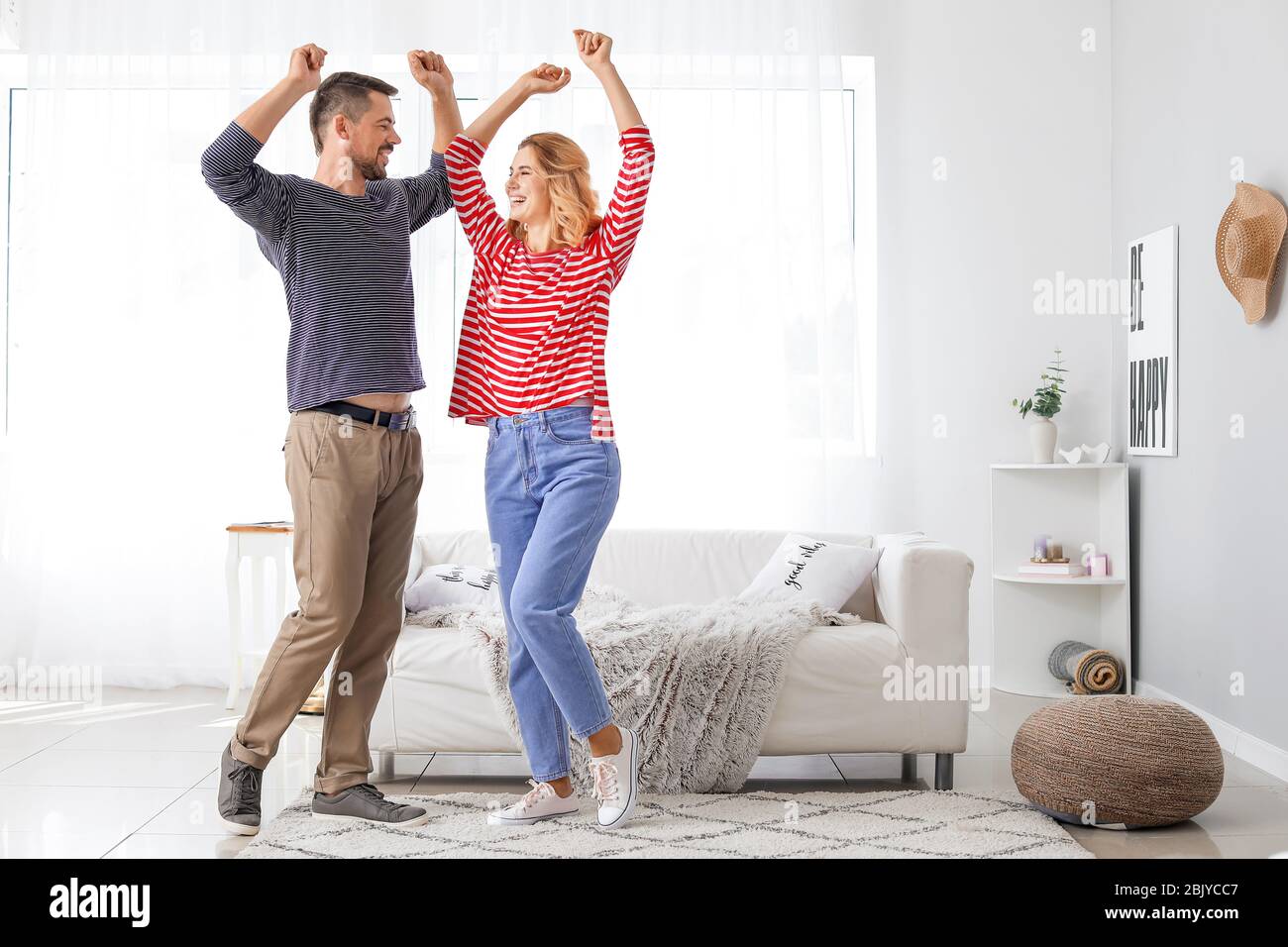 Happy dancing couple at home Stock Photo - Alamy