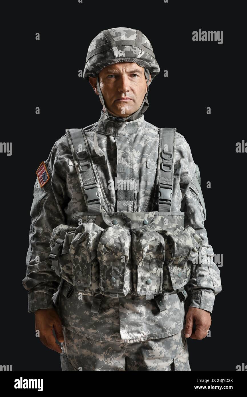 Mature male soldier on dark background Stock Photo - Alamy