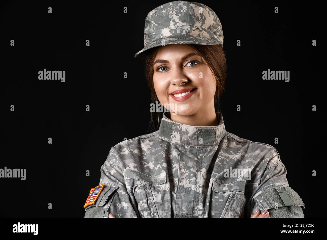 Young female soldier on dark background Stock Photo - Alamy