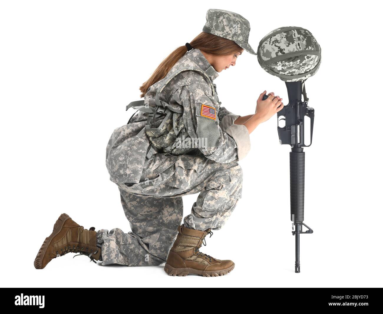 Young female soldier mourning for her dead comrade on white background ...