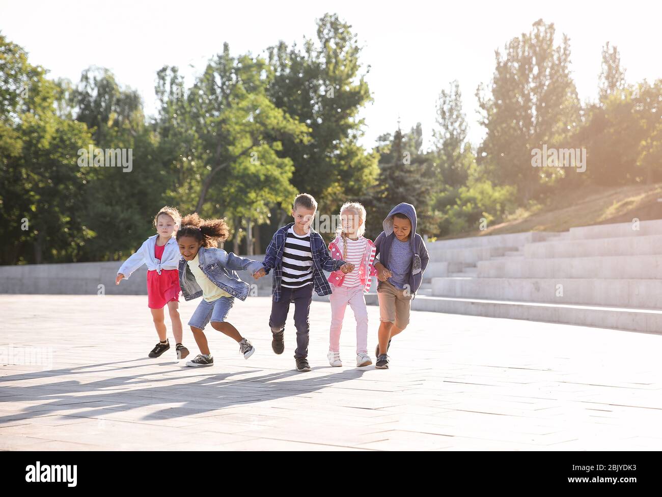 Group of running children outdoors Stock Photo - Alamy