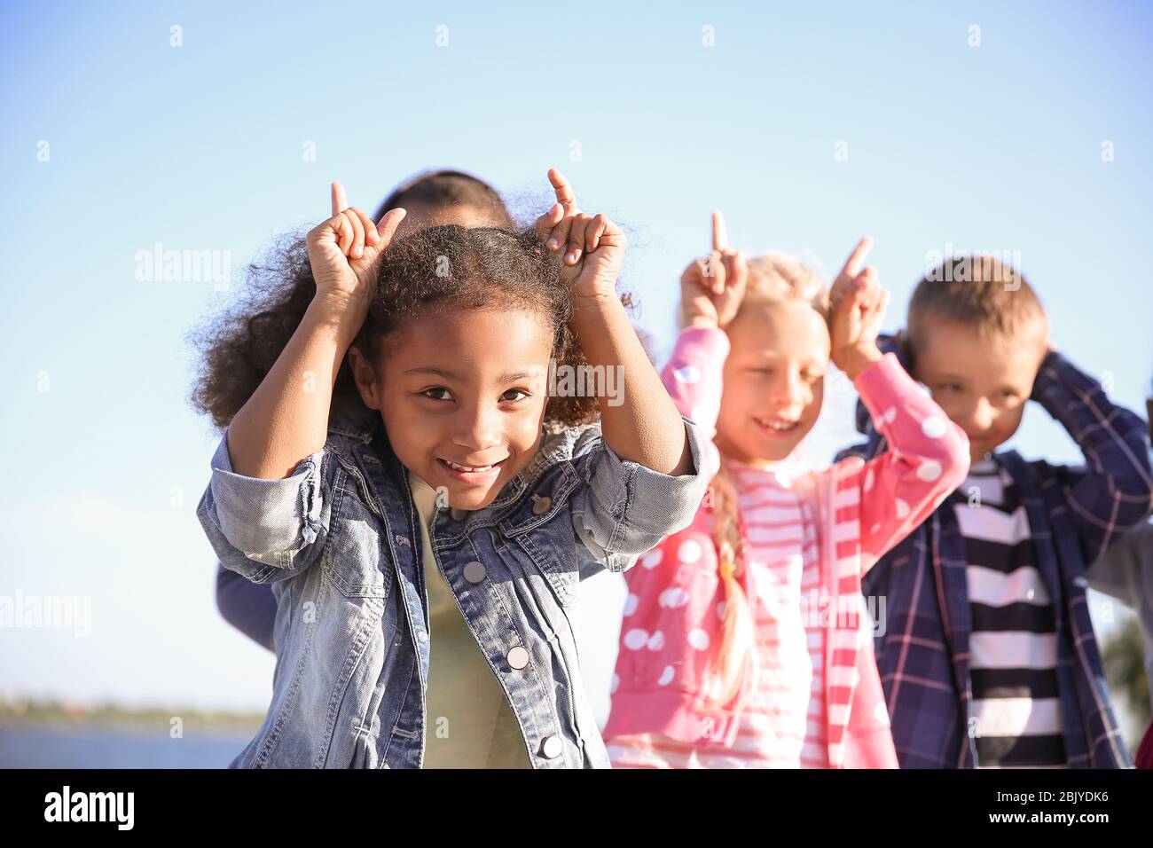 Group of happy children having fun outdoors Stock Photo - Alamy