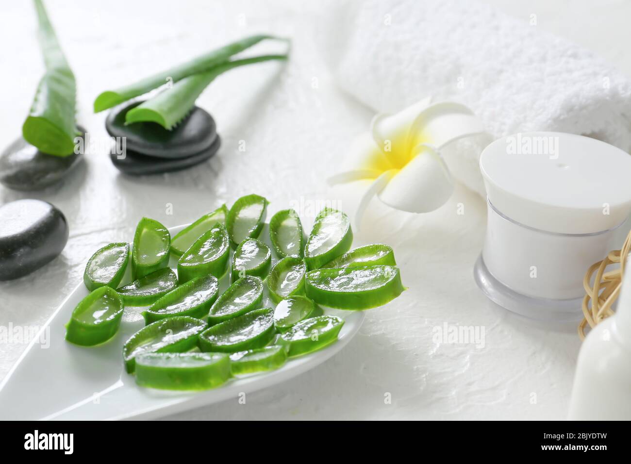 Spa composition with aloe vera on light background Stock Photo - Alamy