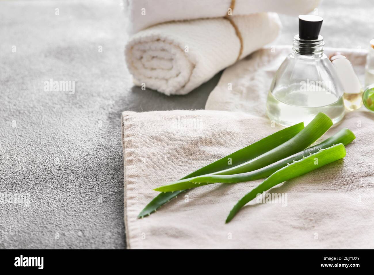 Spa composition with aloe vera on grey background Stock Photo - Alamy