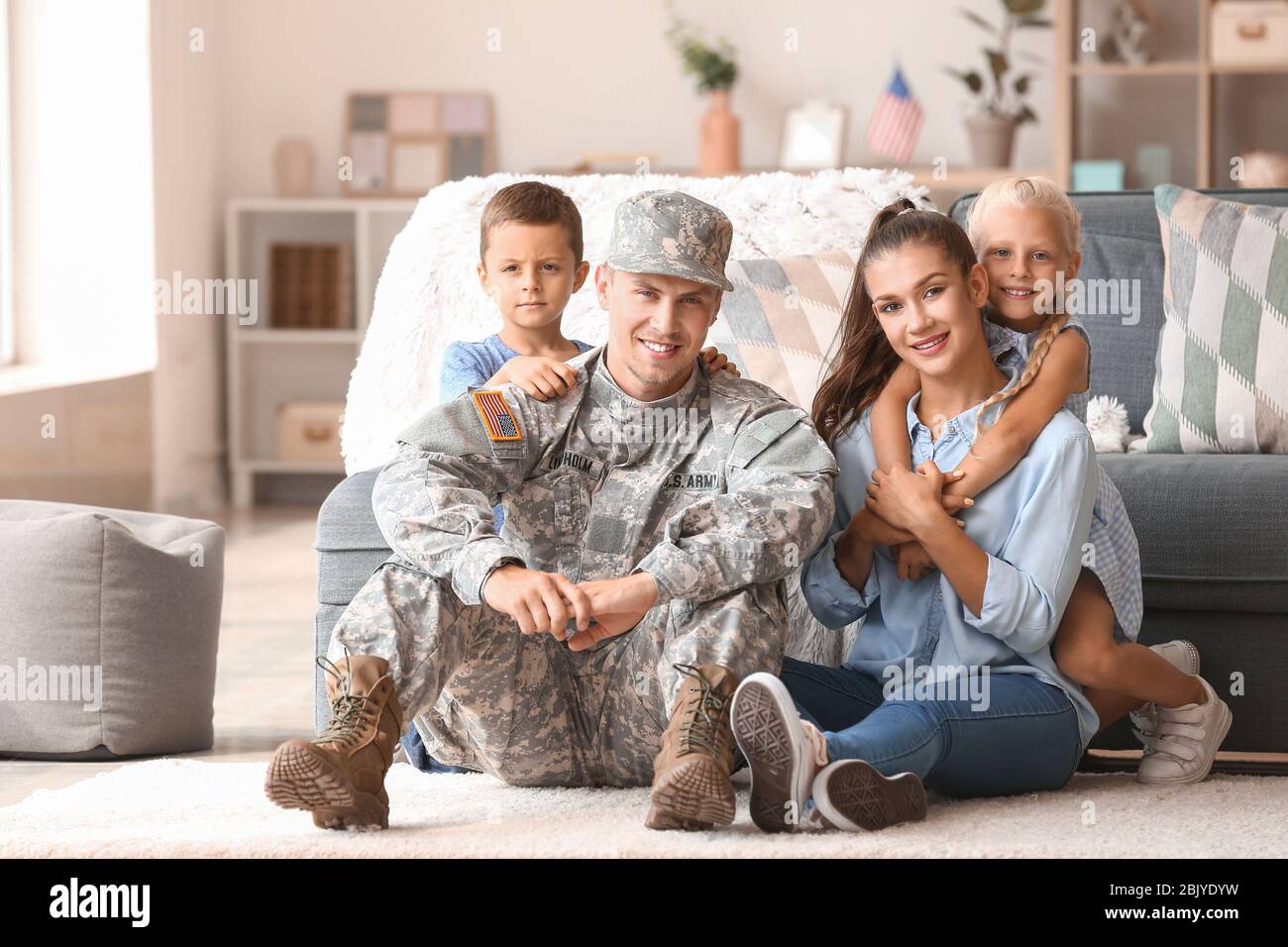 Happy military man with his family at home Stock Photo - Alamy
