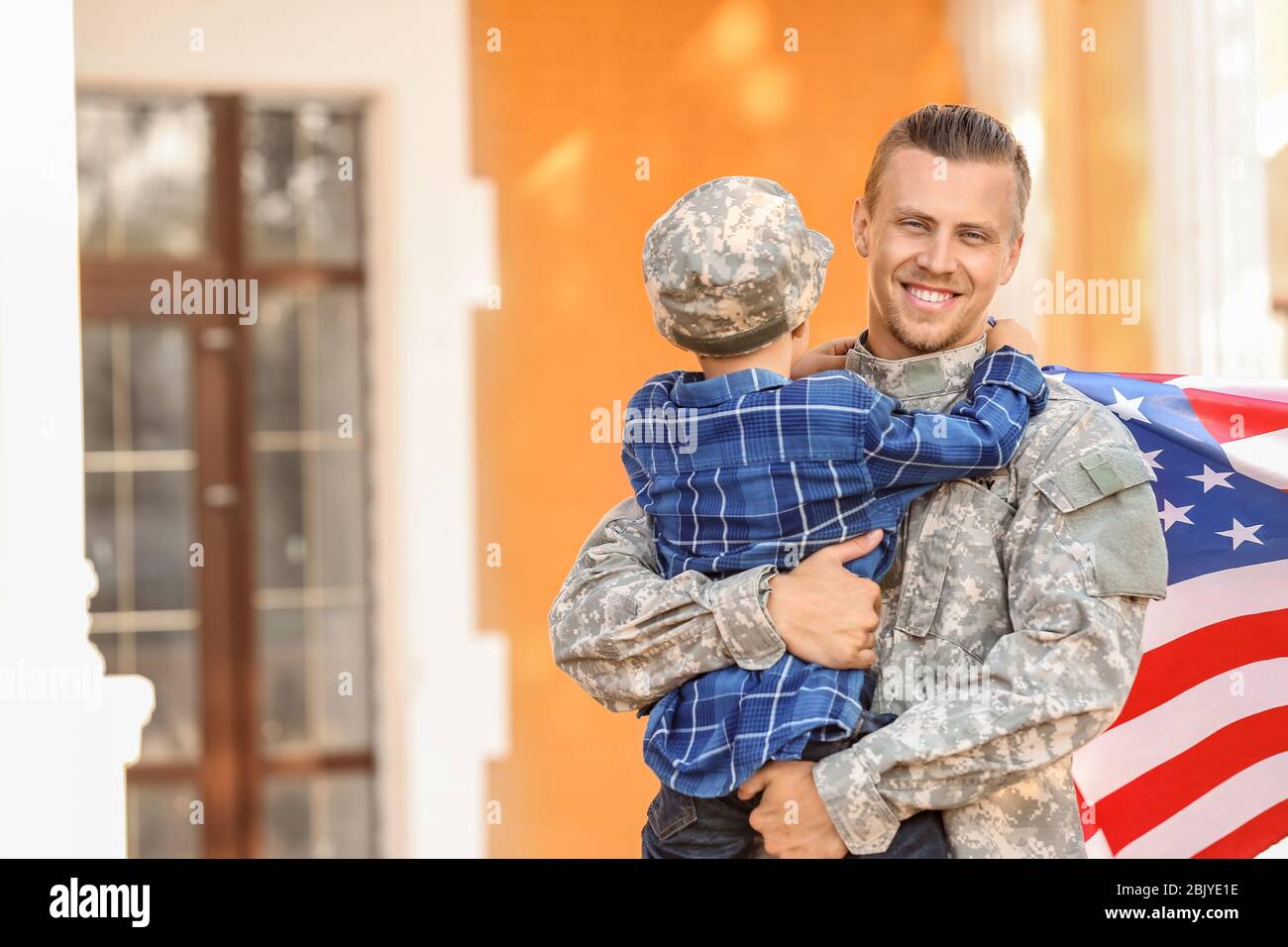 Happy military man with his son outdoors Stock Photo - Alamy
