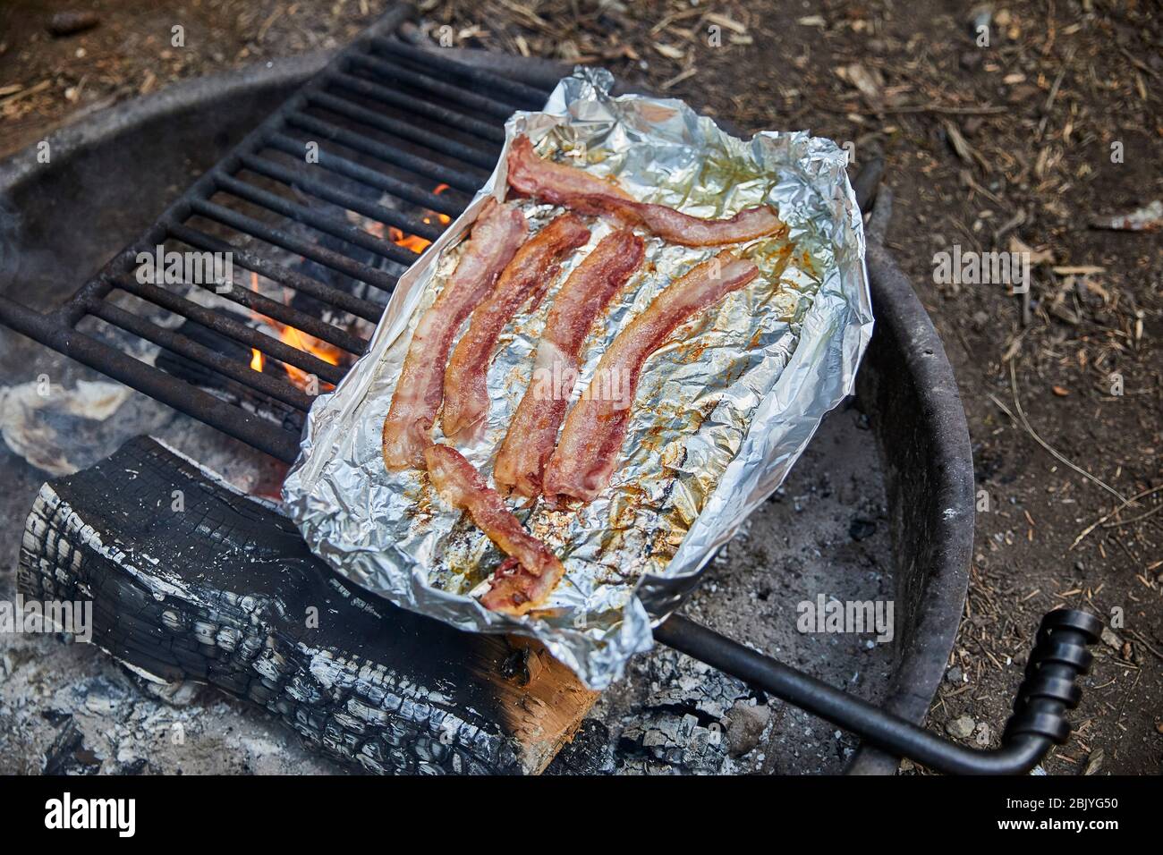 Bacon on barbecue grill Stock Photo - Alamy
