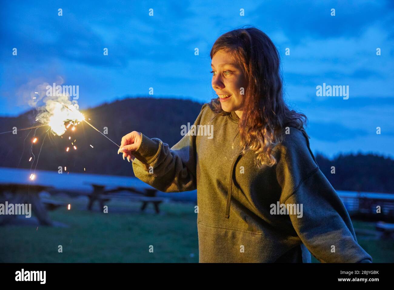 Girl with sparkler Stock Photo - Alamy