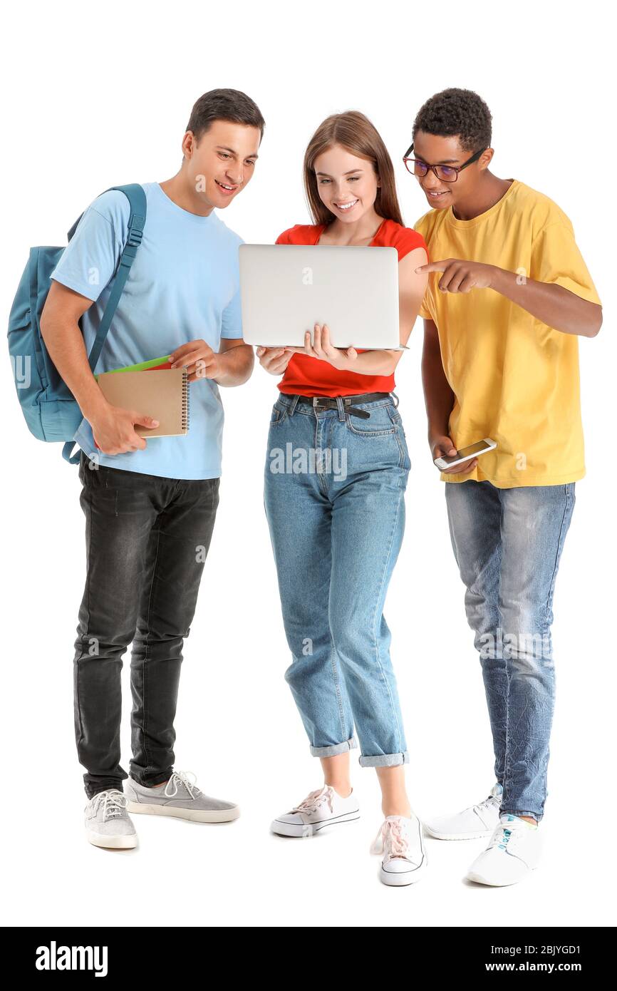 Portrait of young students with laptop on white background Stock Photo ...