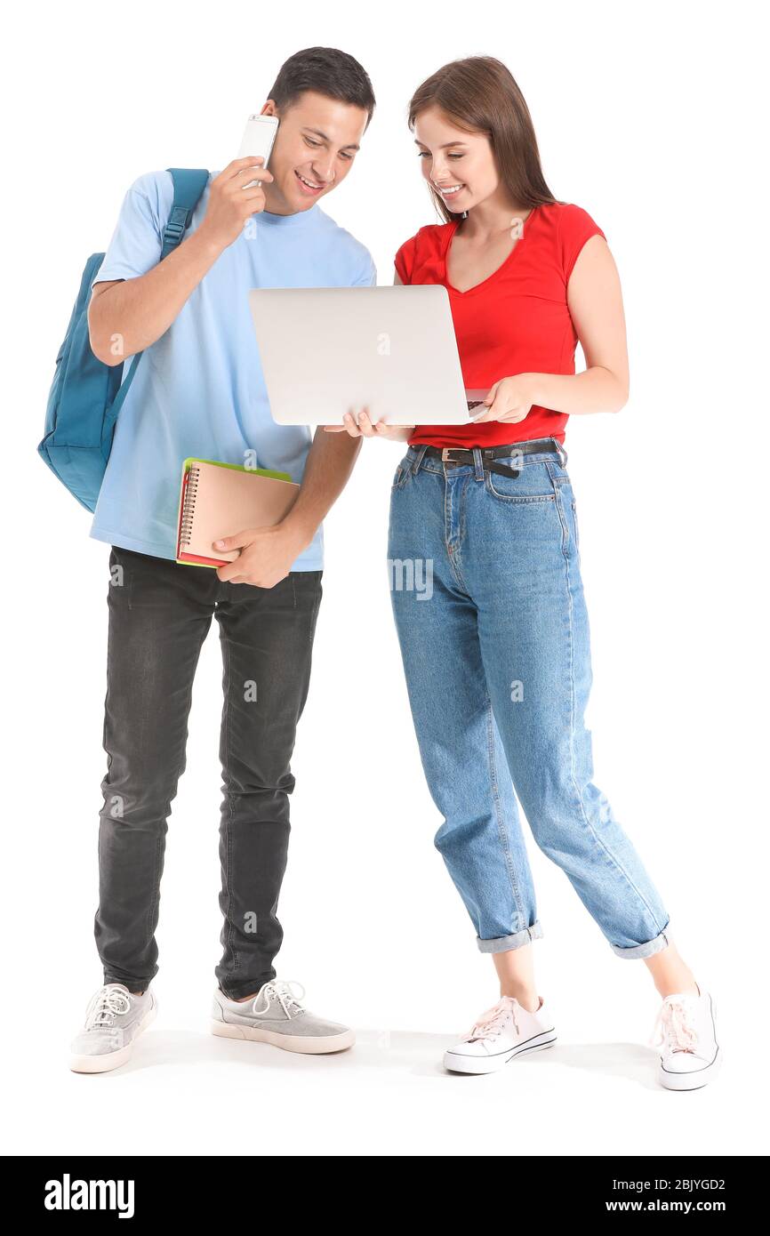 Portrait of young students with laptop on white background Stock Photo ...