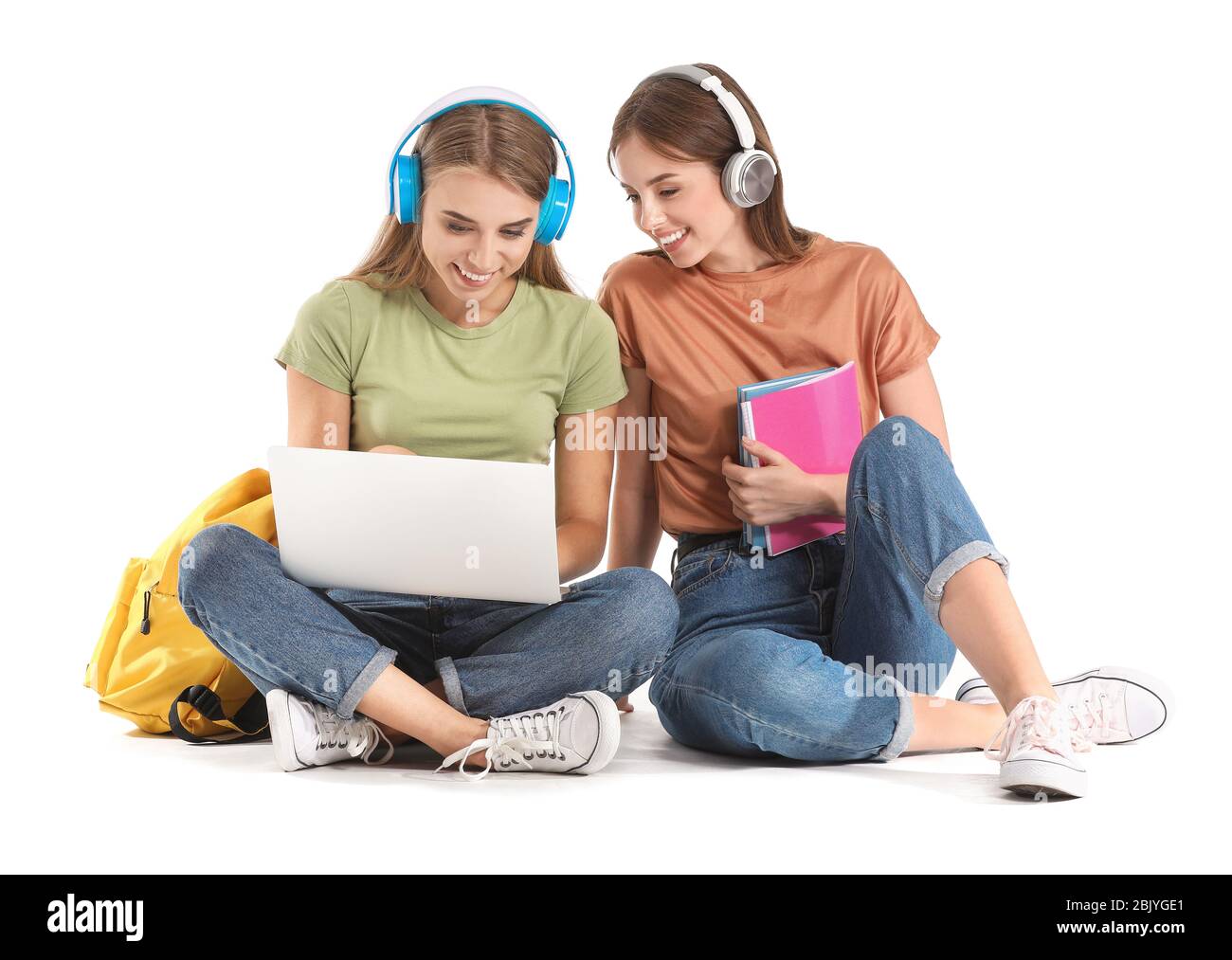 Portrait of young students with laptop on white background Stock Photo ...