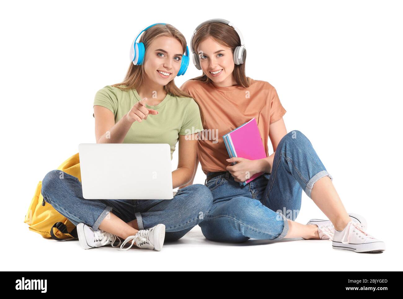 Portrait of young students with laptop on white background Stock Photo ...