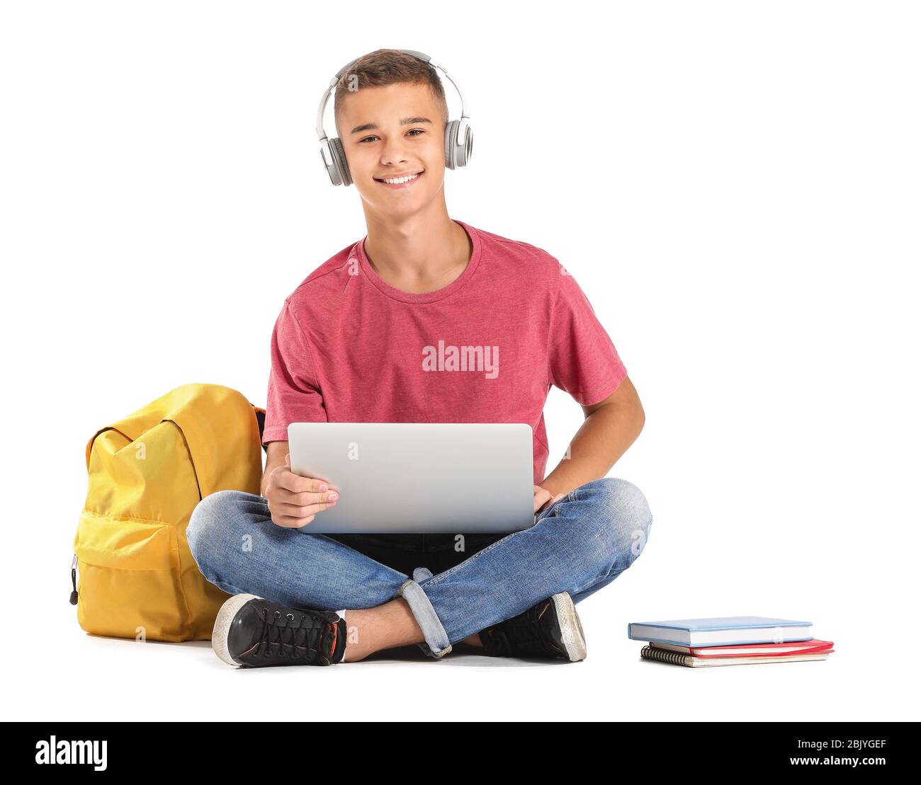 Portrait of young student with laptop on white background Stock Photo ...