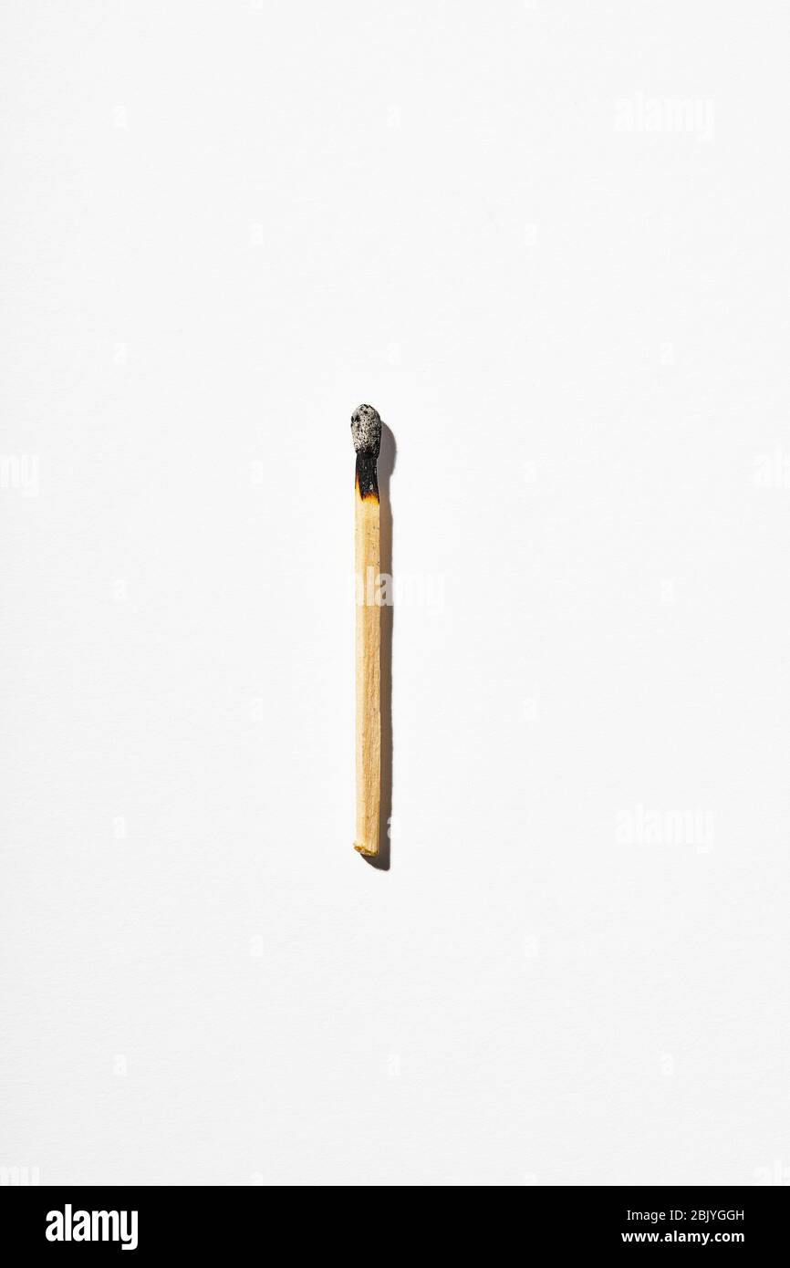 Burnt matchstick on white background Stock Photo - Alamy