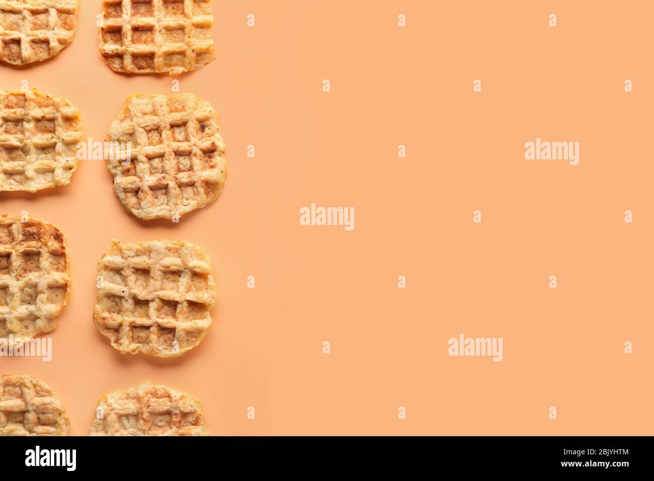 Tasty waffles on color background Stock Photo - Alamy