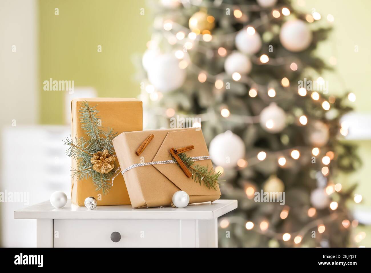 Beautiful gift boxes on table in room Stock Photo - Alamy
