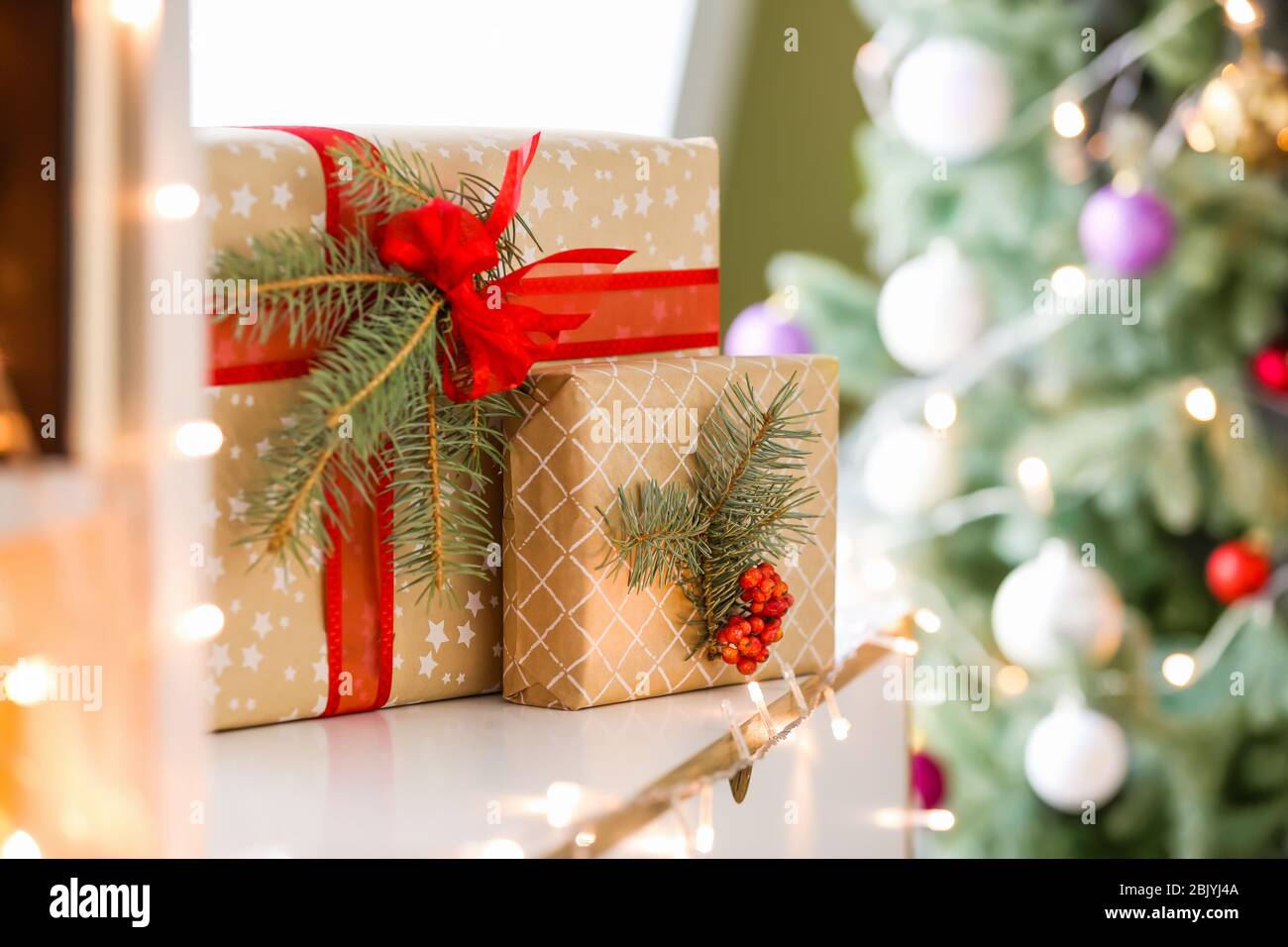 Beautiful gift boxes on table in room Stock Photo - Alamy
