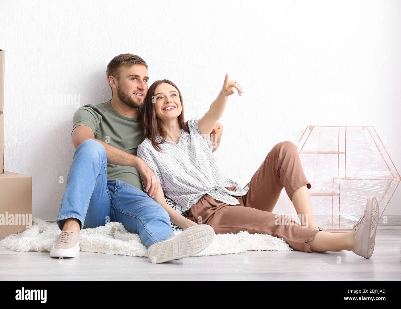 Young couple planning design of their new house Stock Photo - Alamy