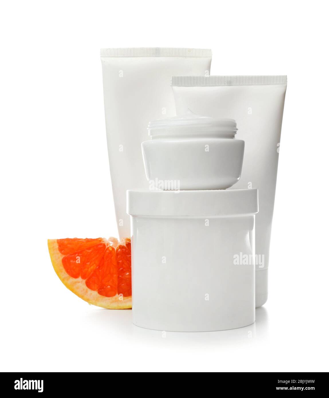 Different body cream on white background Stock Photo - Alamy