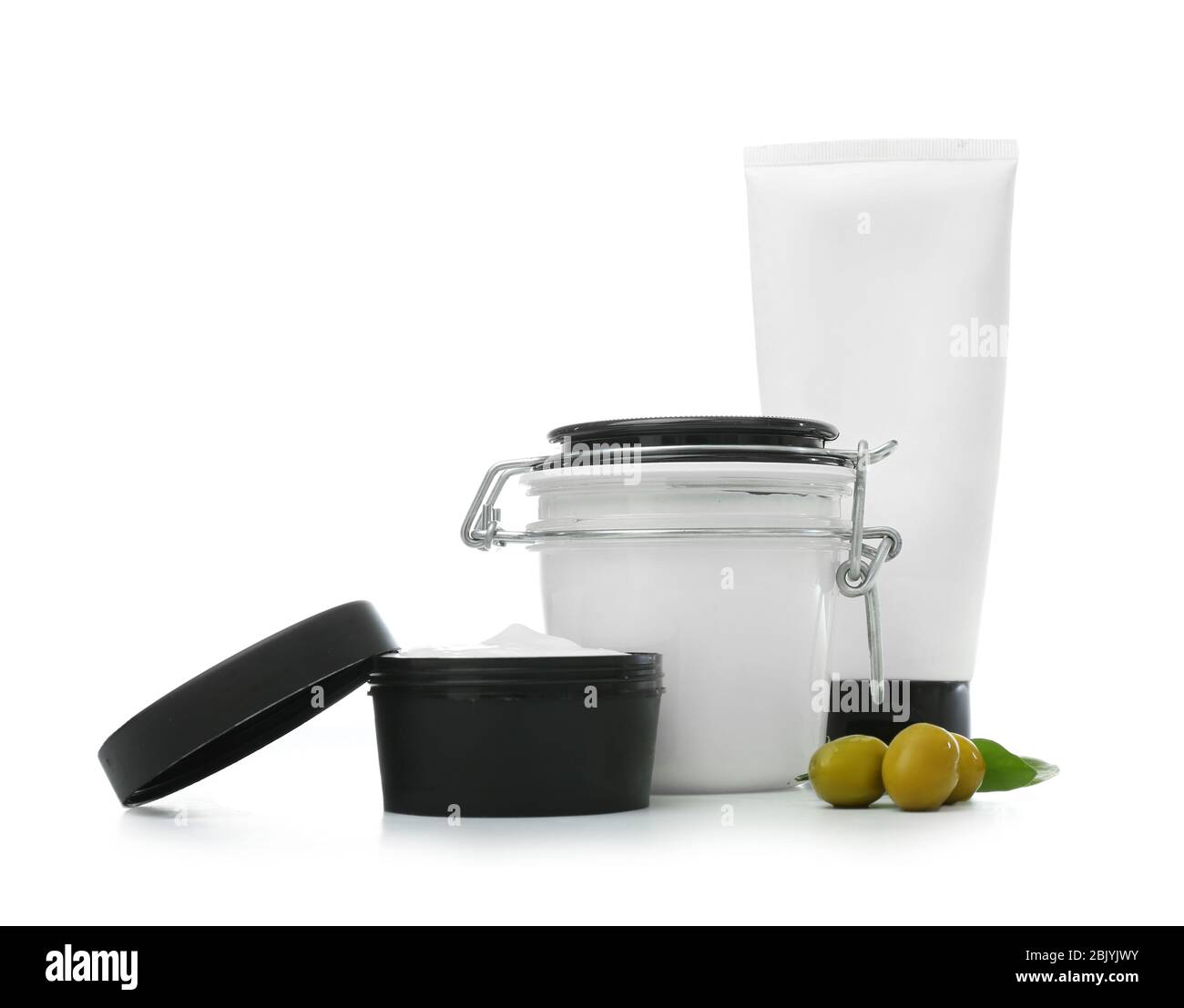 Different body cream on white background Stock Photo - Alamy