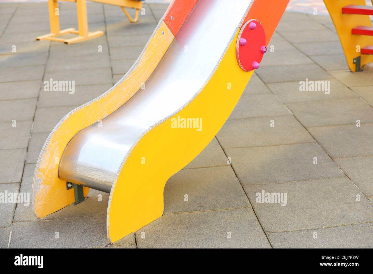 Slide on playground in park Stock Photo - Alamy
