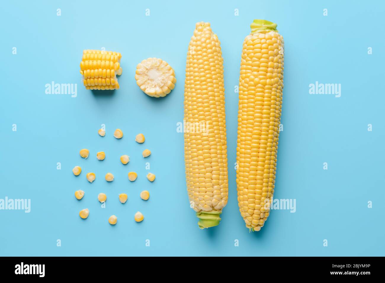 Fresh corn cobs on color background Stock Photo - Alamy