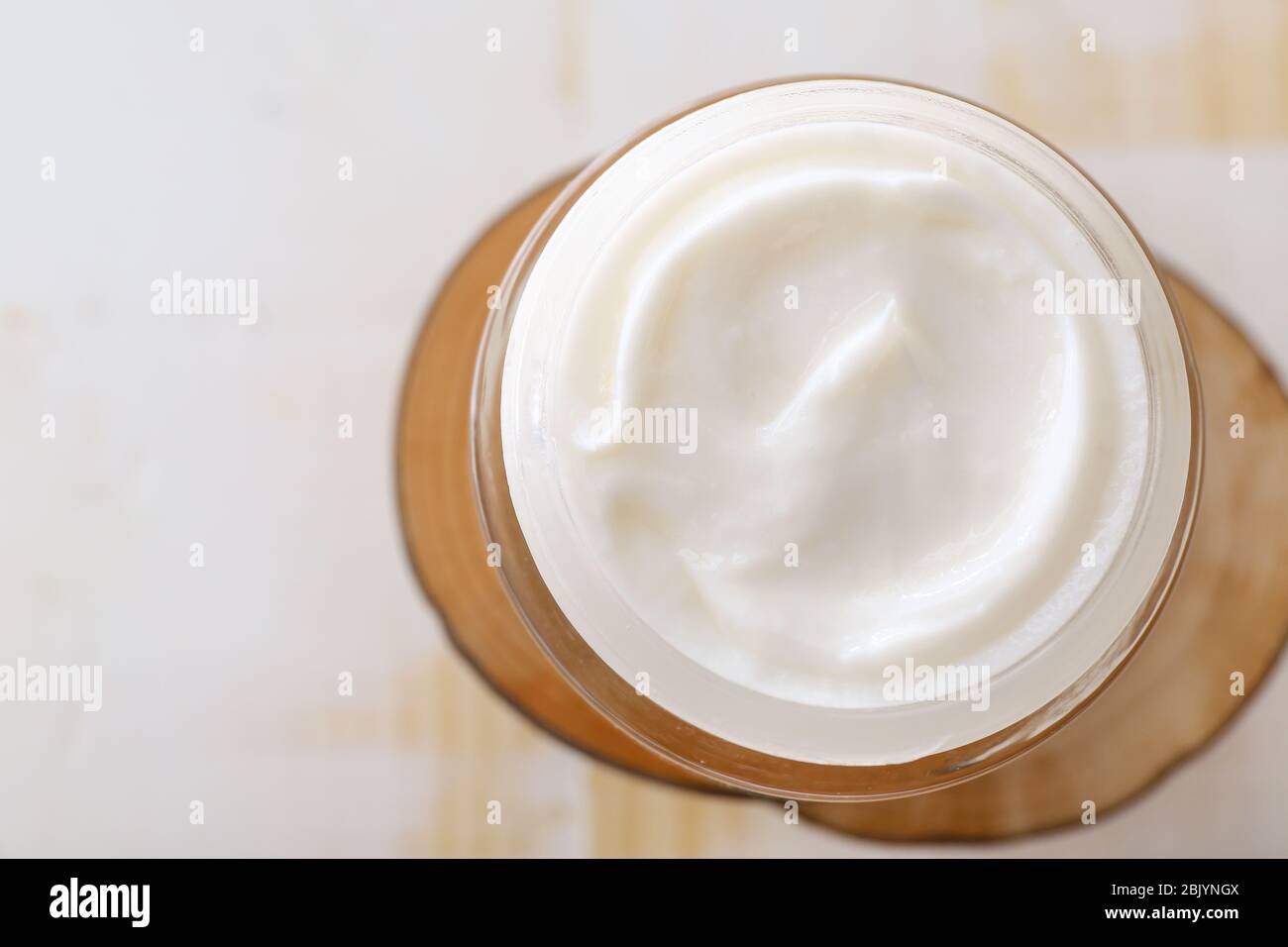 Jar of natural cream on light background Stock Photo - Alamy