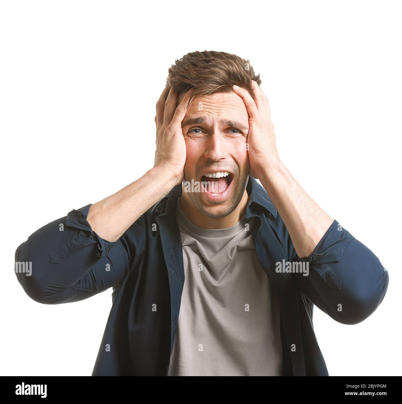 Stressed young man on white background Stock Photo - Alamy
