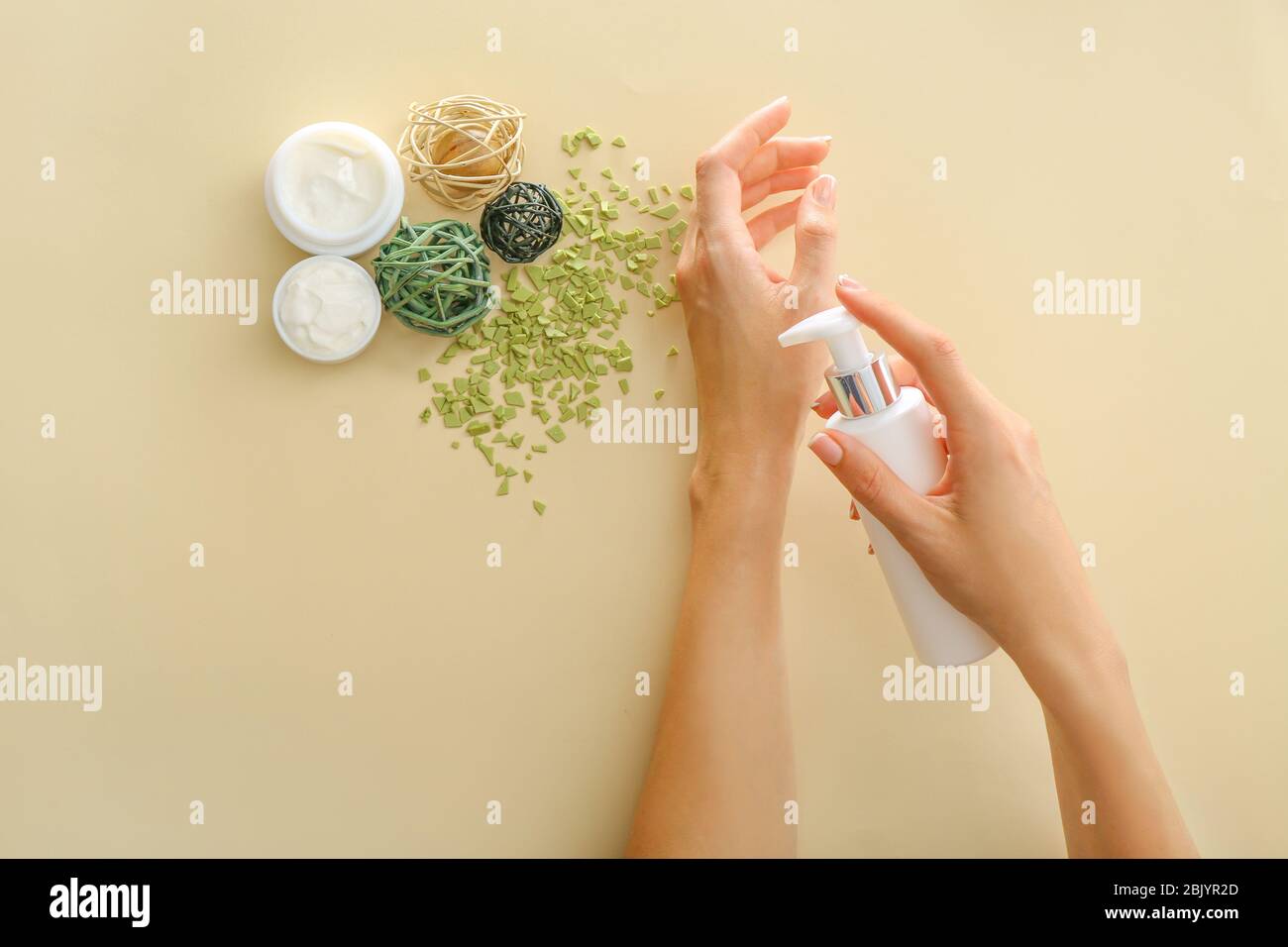 Female hands with natural cream on color background Stock Photo - Alamy