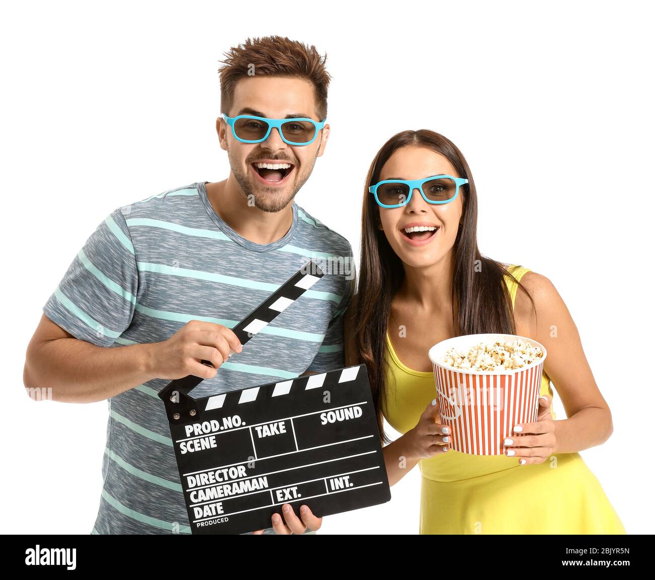 Young couple with popcorn and movie clapper on white background Stock ...
