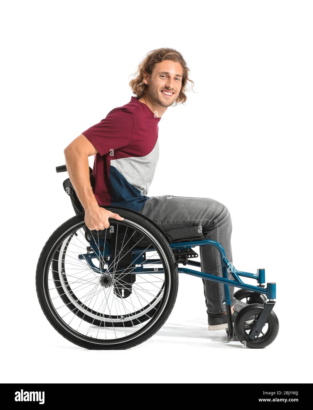 Handsome man in wheelchair on white background Stock Photo - Alamy