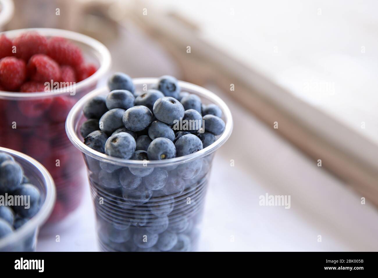 Fresh blueberries on counter at market Stock Photo - Alamy