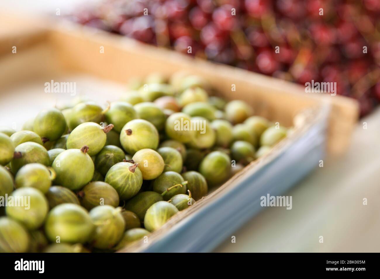 Fresh gooseberry on counter at market Stock Photo - Alamy