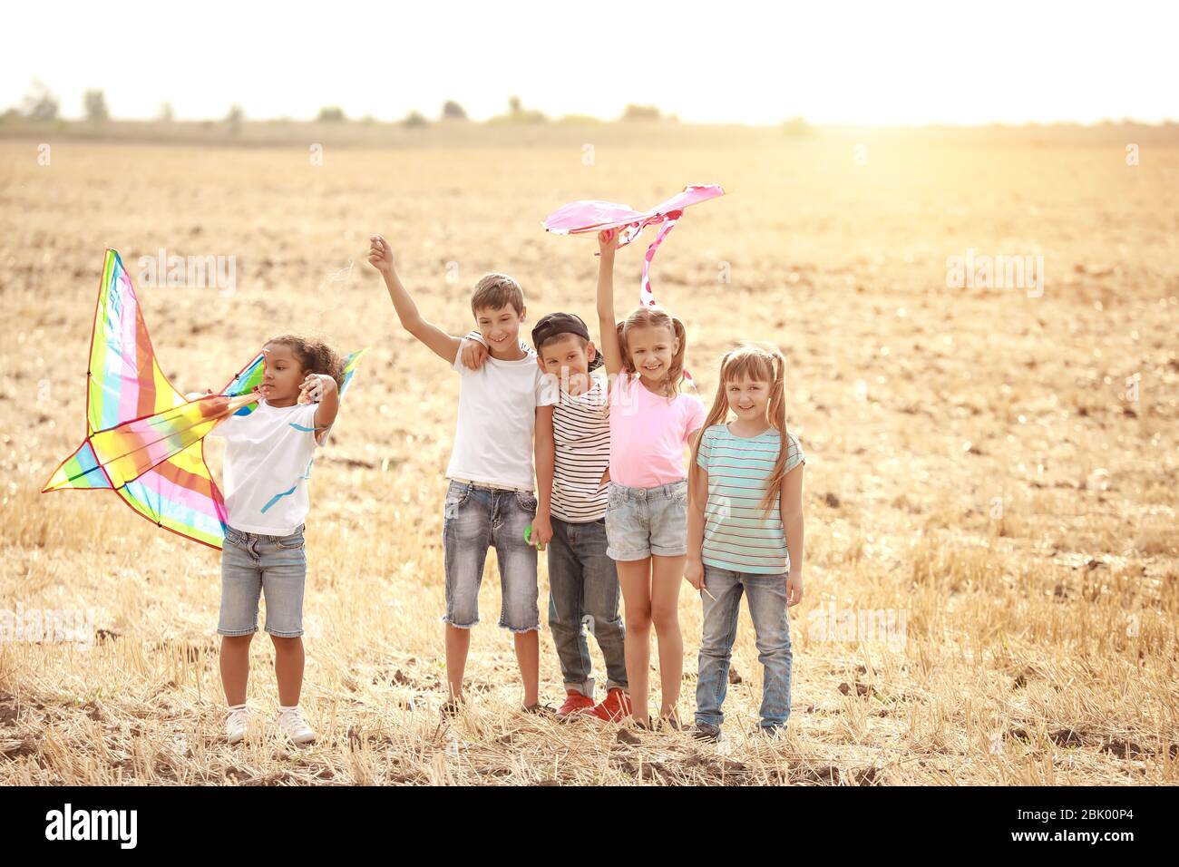 Little children flying kites outdoors Stock Photo - Alamy