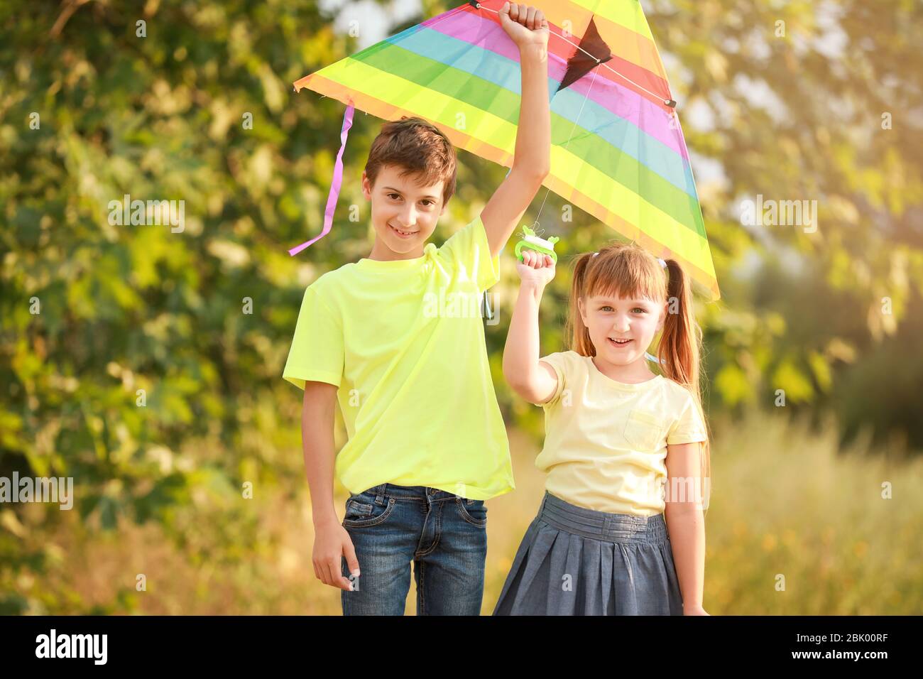 Little children flying kite outdoors Stock Photo - Alamy