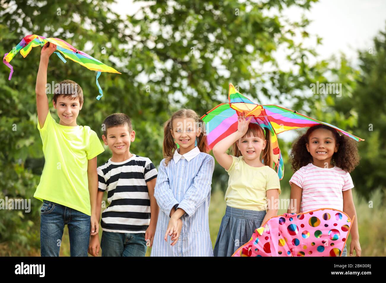Little children flying kites outdoors Stock Photo - Alamy