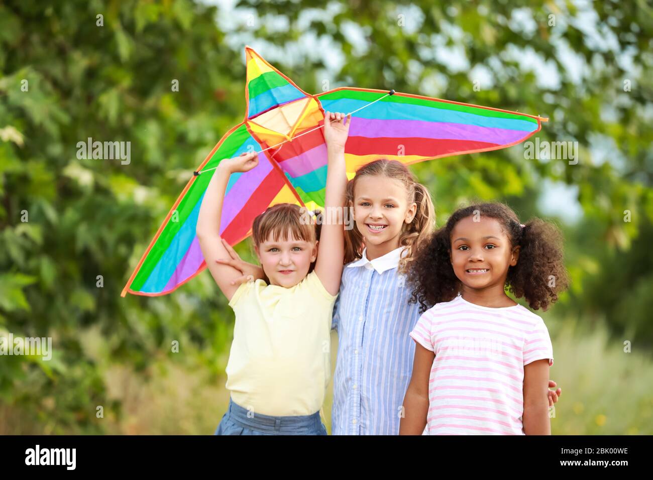Little girls flying kite outdoors Stock Photo - Alamy